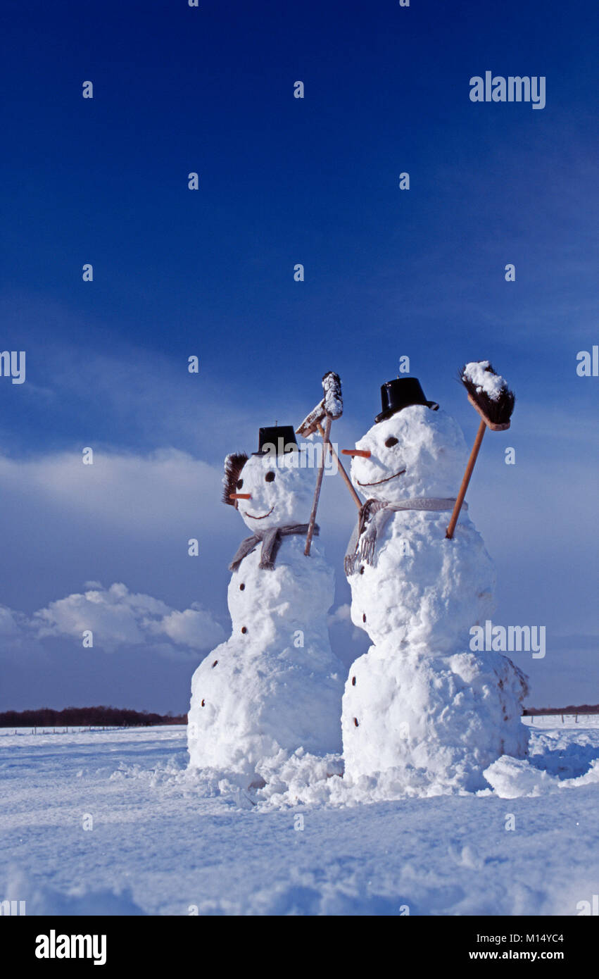 Two people with snowmen hi-res stock photography and images - Alamy