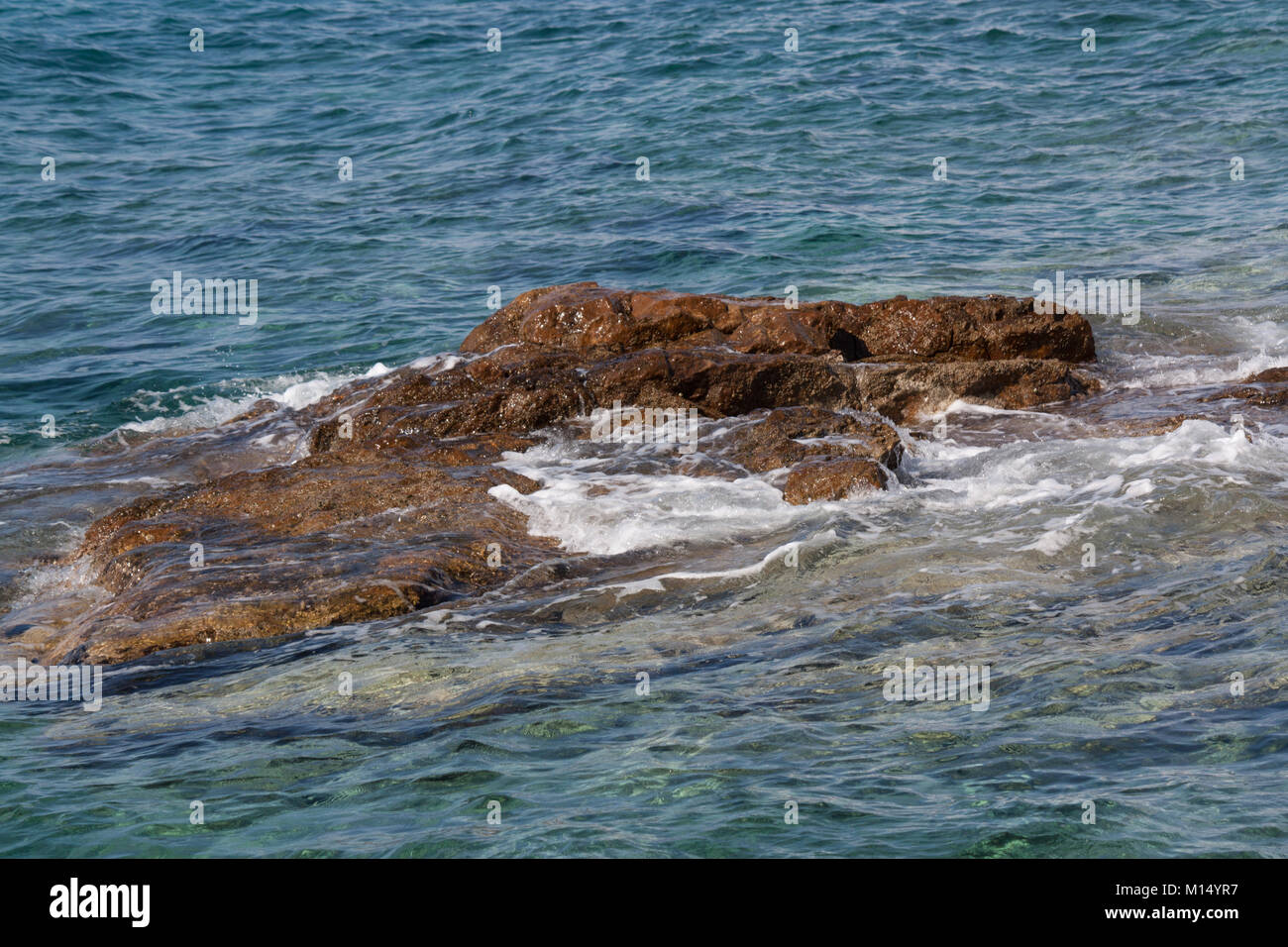 rocks in water at the beach Stock Photo - Alamy