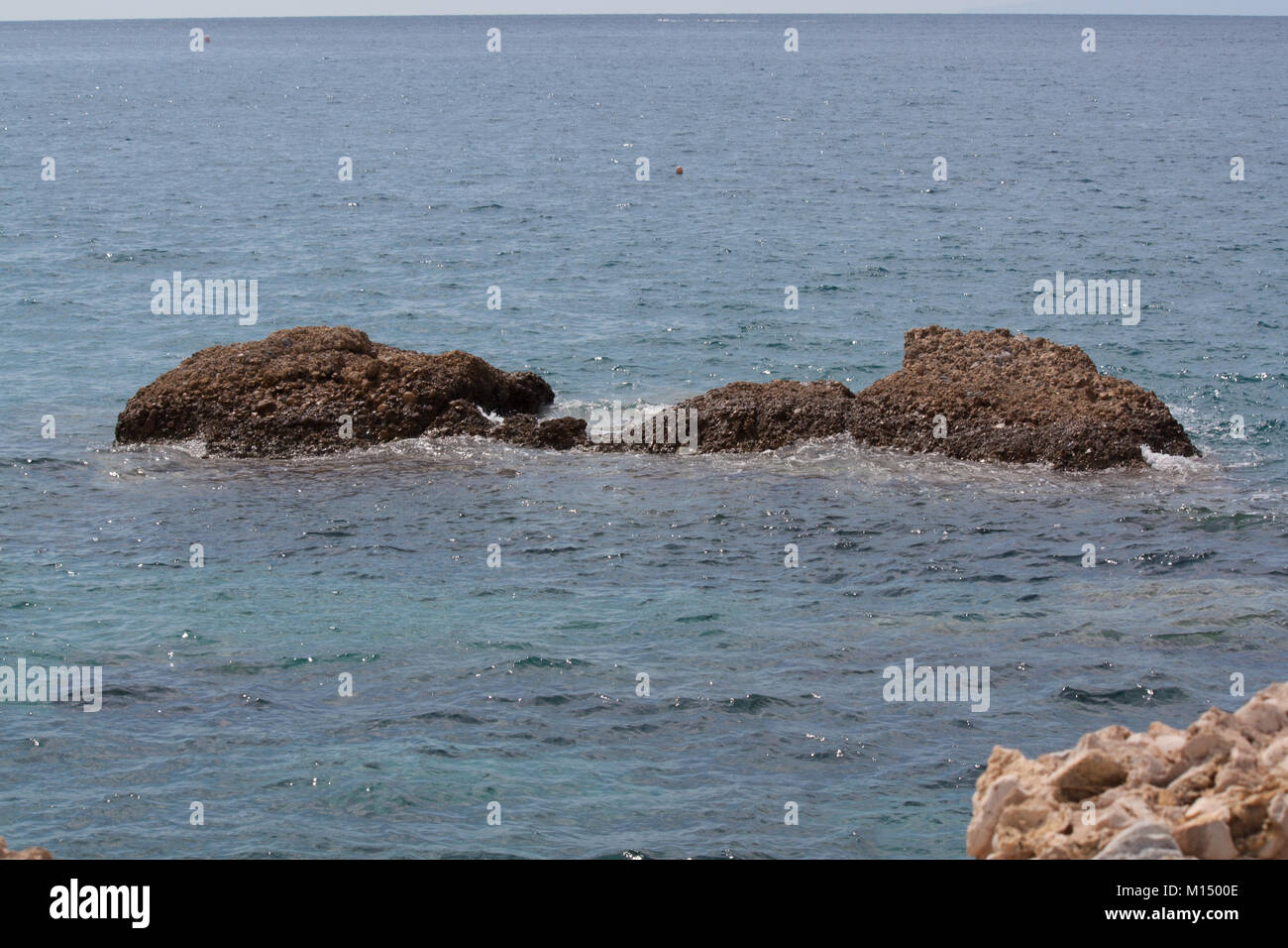 rocks in water at the beach Stock Photo - Alamy