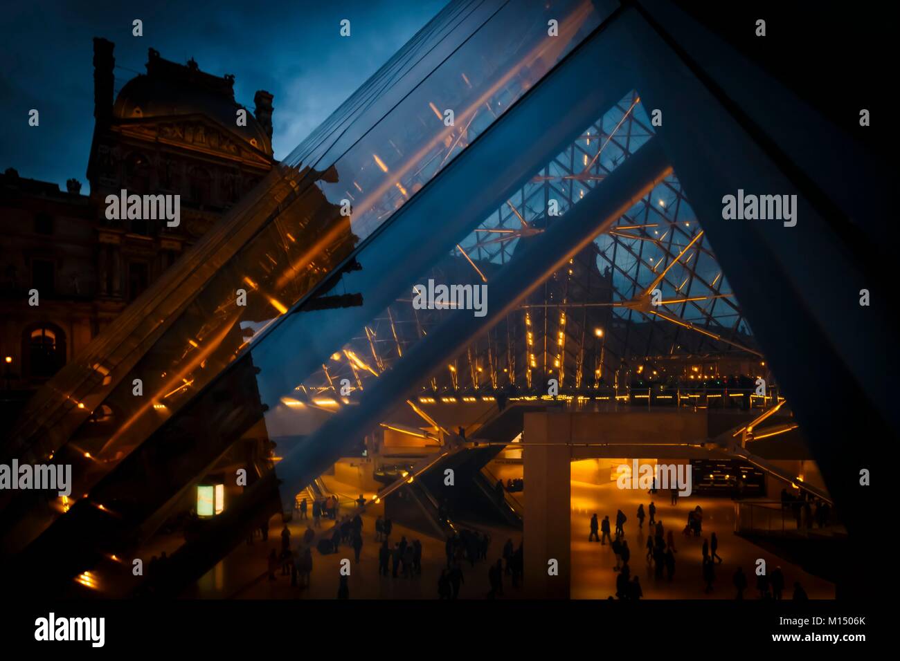 View down into the underground lobby at the entrance to the Louvre ...