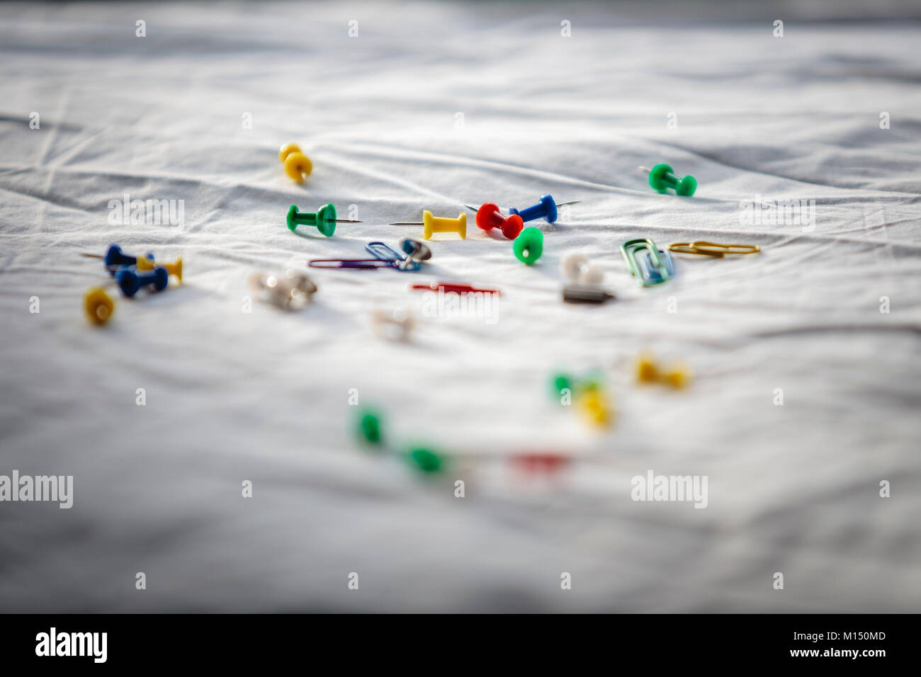 Pins and clips on a table Stock Photo - Alamy