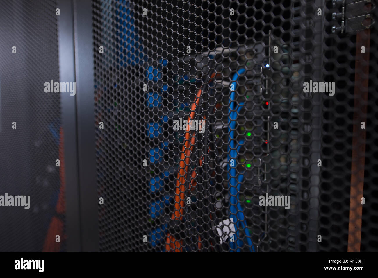 closeup of a modern data center hardware rear side of storage server ...