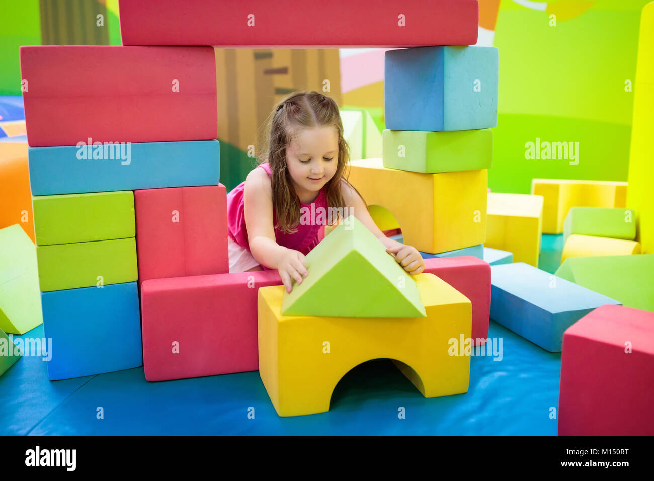 Child playing with colorful construction toy blocks. Educational toys ...