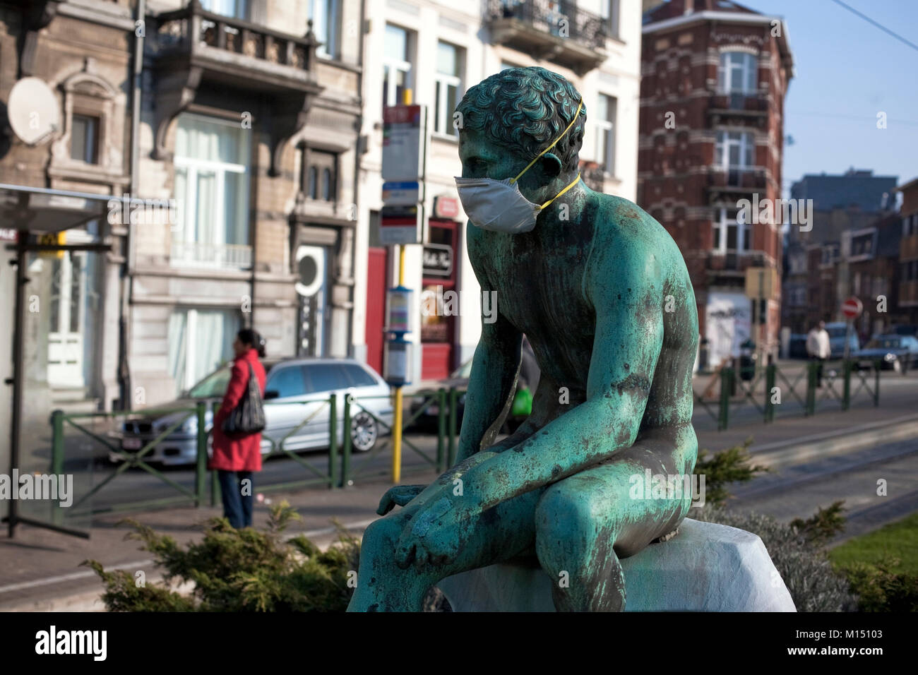 Statue wearing mask as protection against pollution, on Avenue du Parc ...