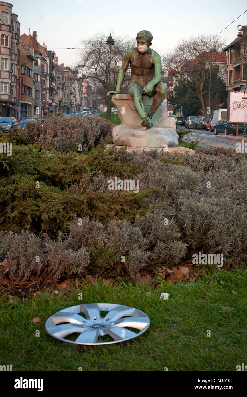 Statue wearing mask as protection against pollution, on Avenue du Parc ...