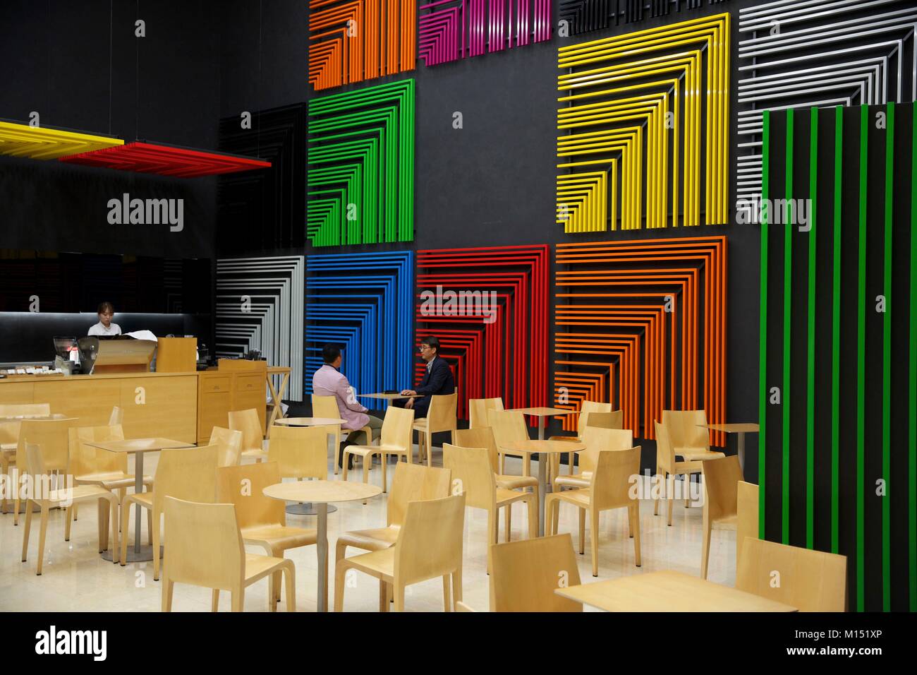 South Korea, Seoul, Itaewon, men sitting of the design cafe of the ...