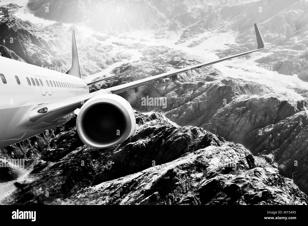 Plane flight sky mountains snow travel transport Stock Photo - Alamy