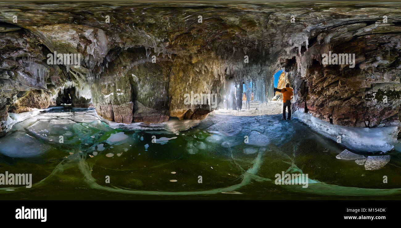 Panorama man in an ice cave with icicles on Baikal, Olkhon, Spherical ...