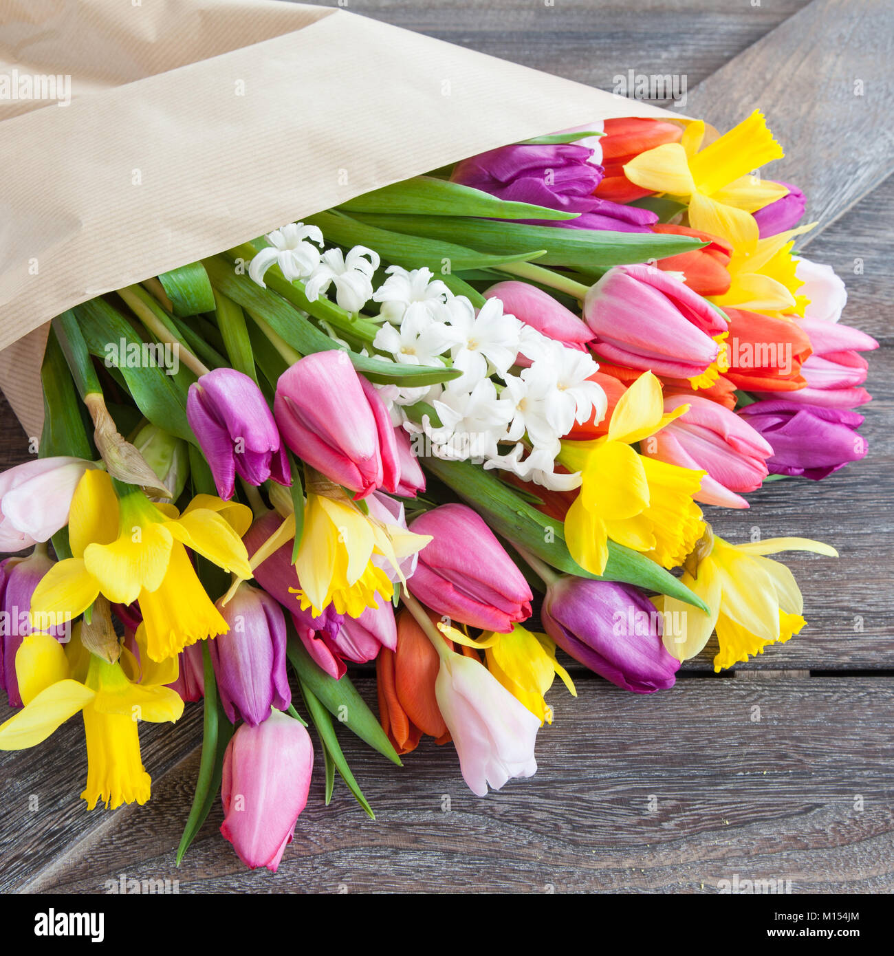 Bunch of colorful spring flowers on rustic wooden background Stock ...