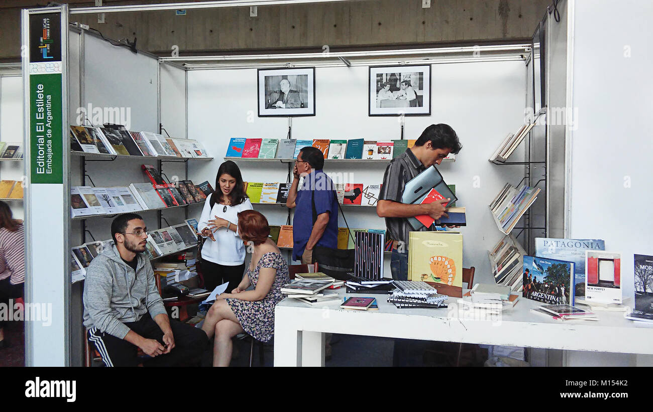 Young people looking at books at A Book Festival in Caracas Stock Photo ...