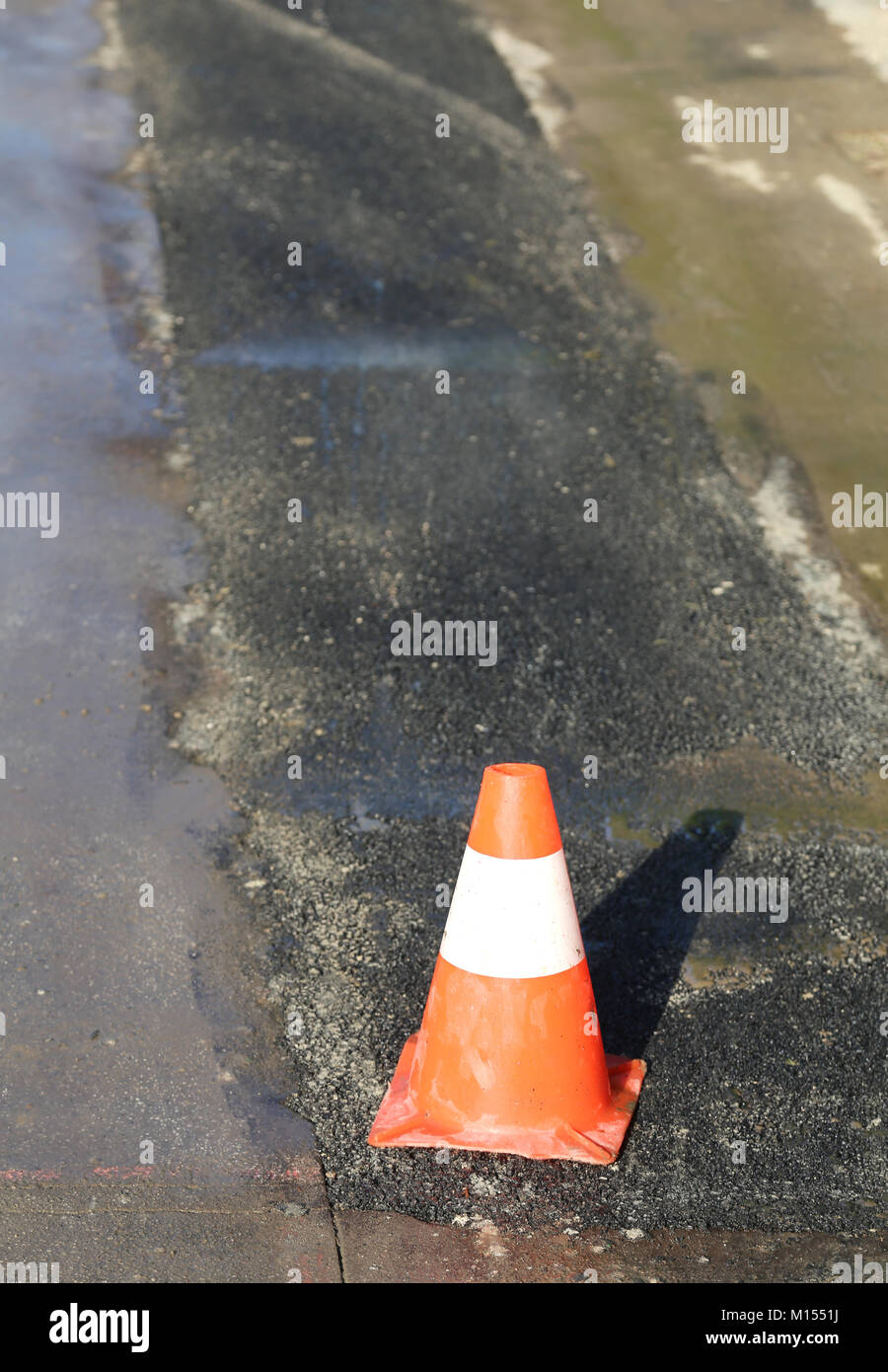 road cone used to asphalt demarcation during road asphalting works ...