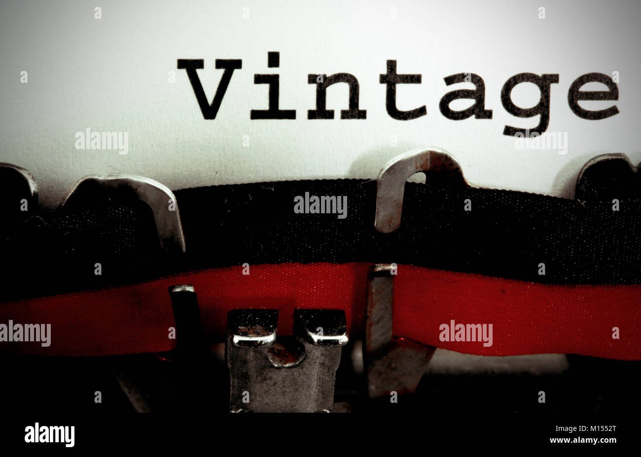 Big VINTAGE written with the old typewriter on white page Stock Photo ...