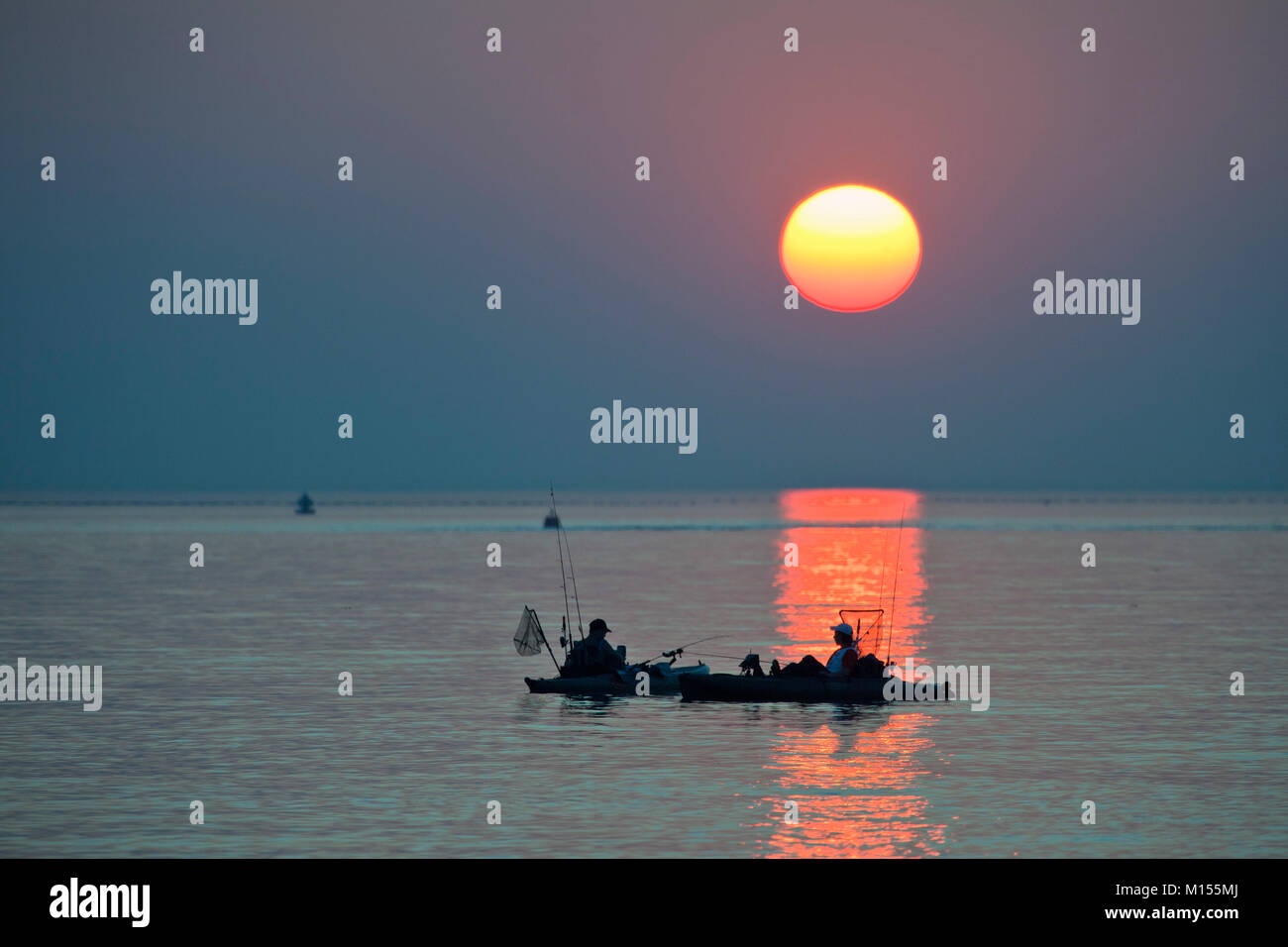 The Netherlands, Zierikzee, Fishermen in cycle-kayak with electric ...