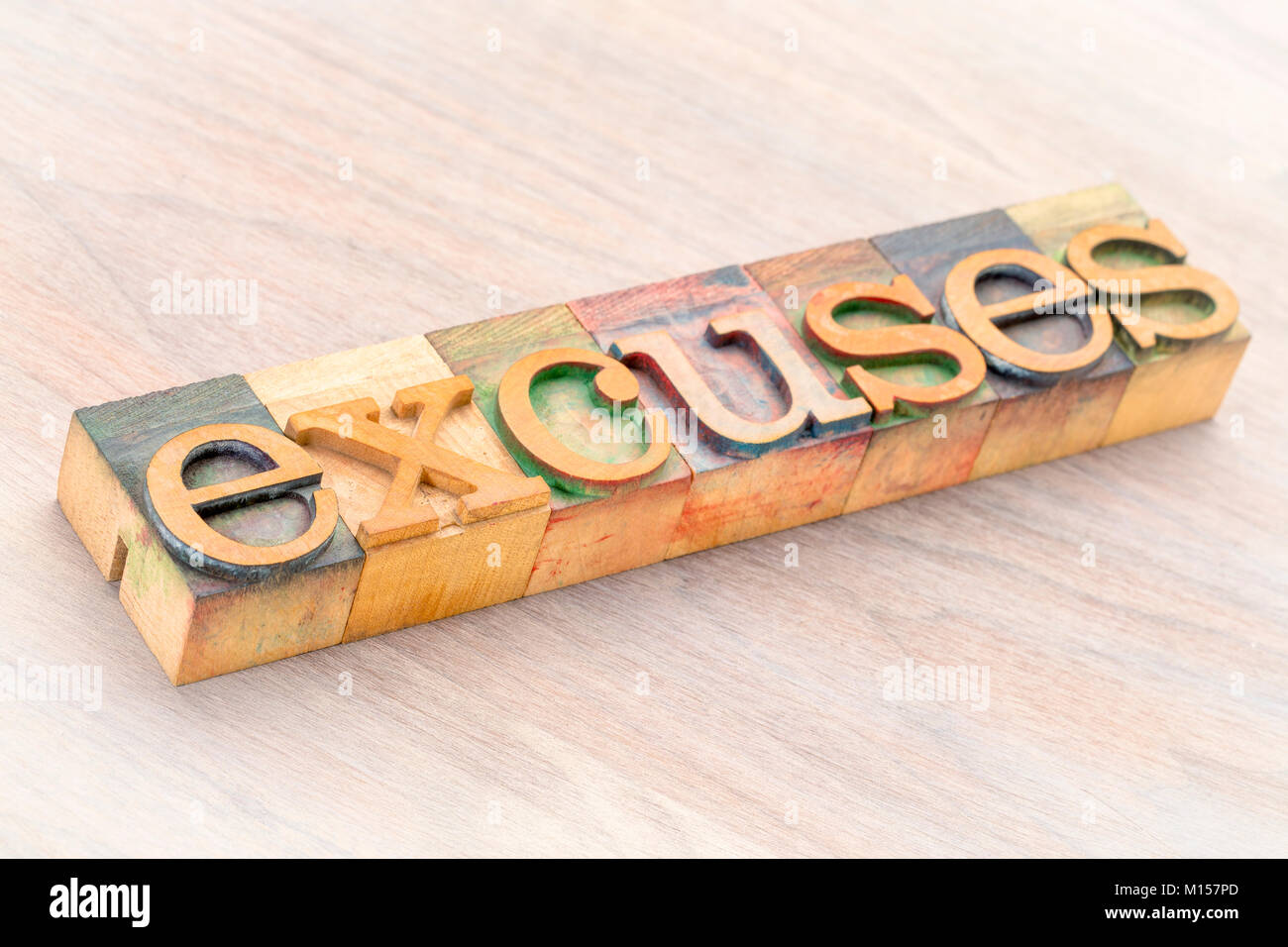 excuses word abstract in letterprtess wood type blocks stained by color ...