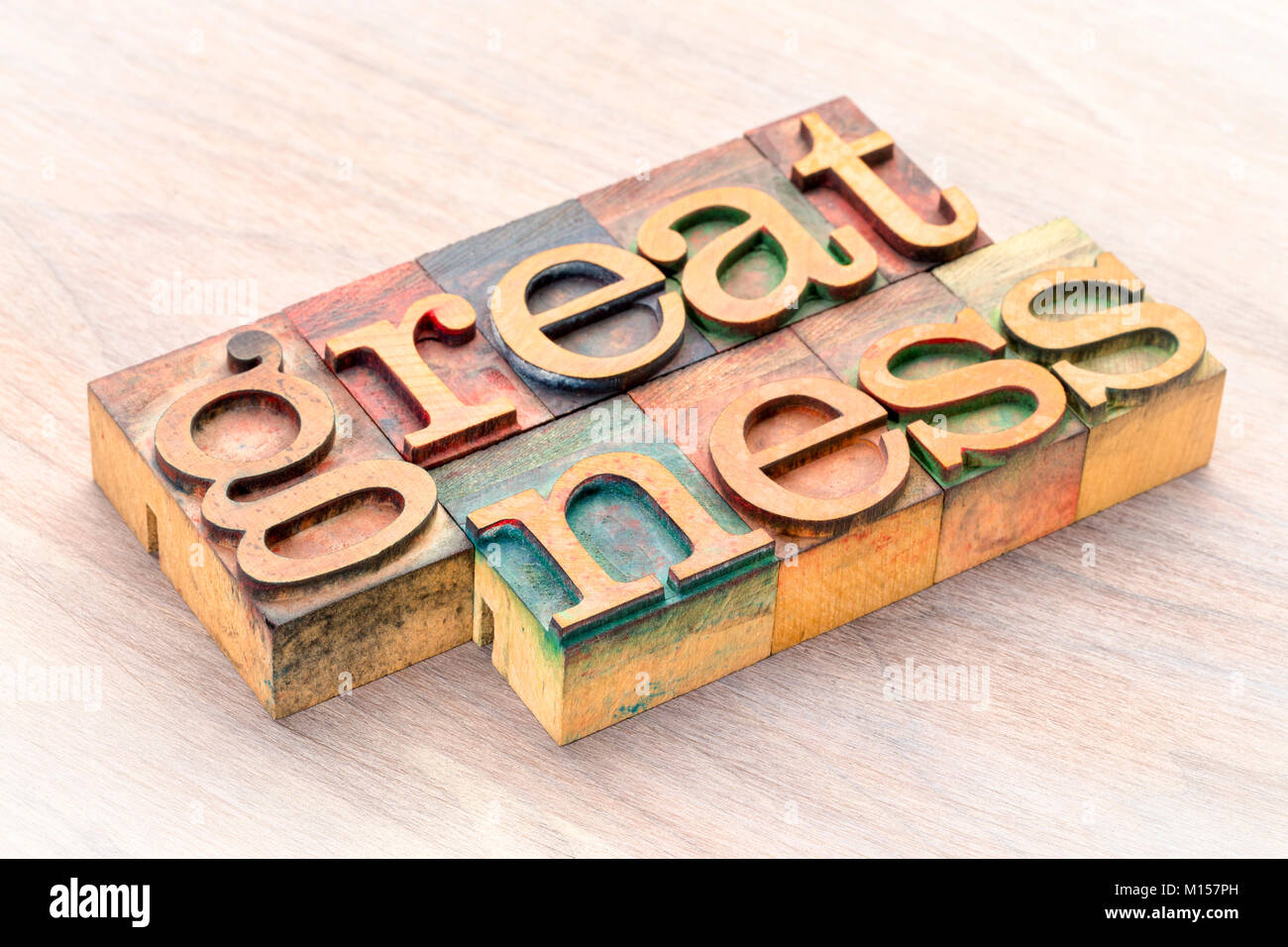 greatness word abstract in letterprtess wood type blocks stained by ...