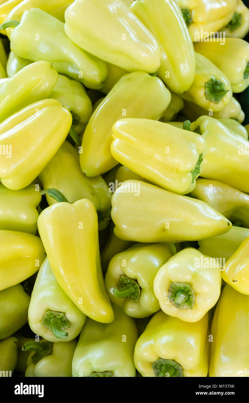 Fresh yellow peppers for sale at the farmers market Stock Photo - Alamy