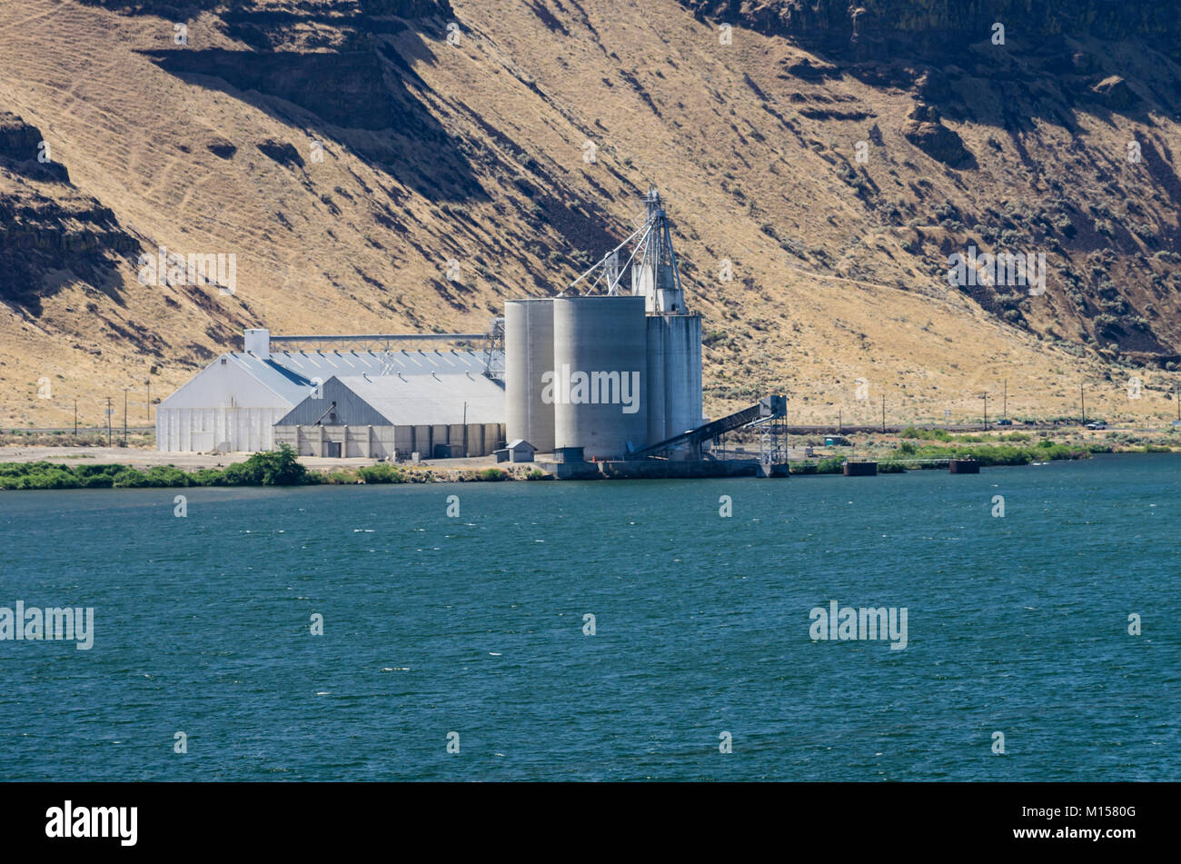 Grain storage and loading facility with silos and conveyors on the ...
