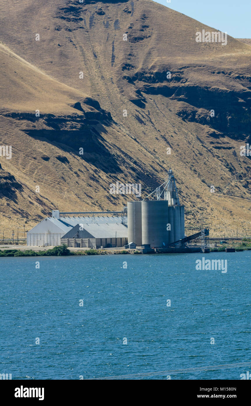 Grain storage and loading facility with silos and conveyors on the ...