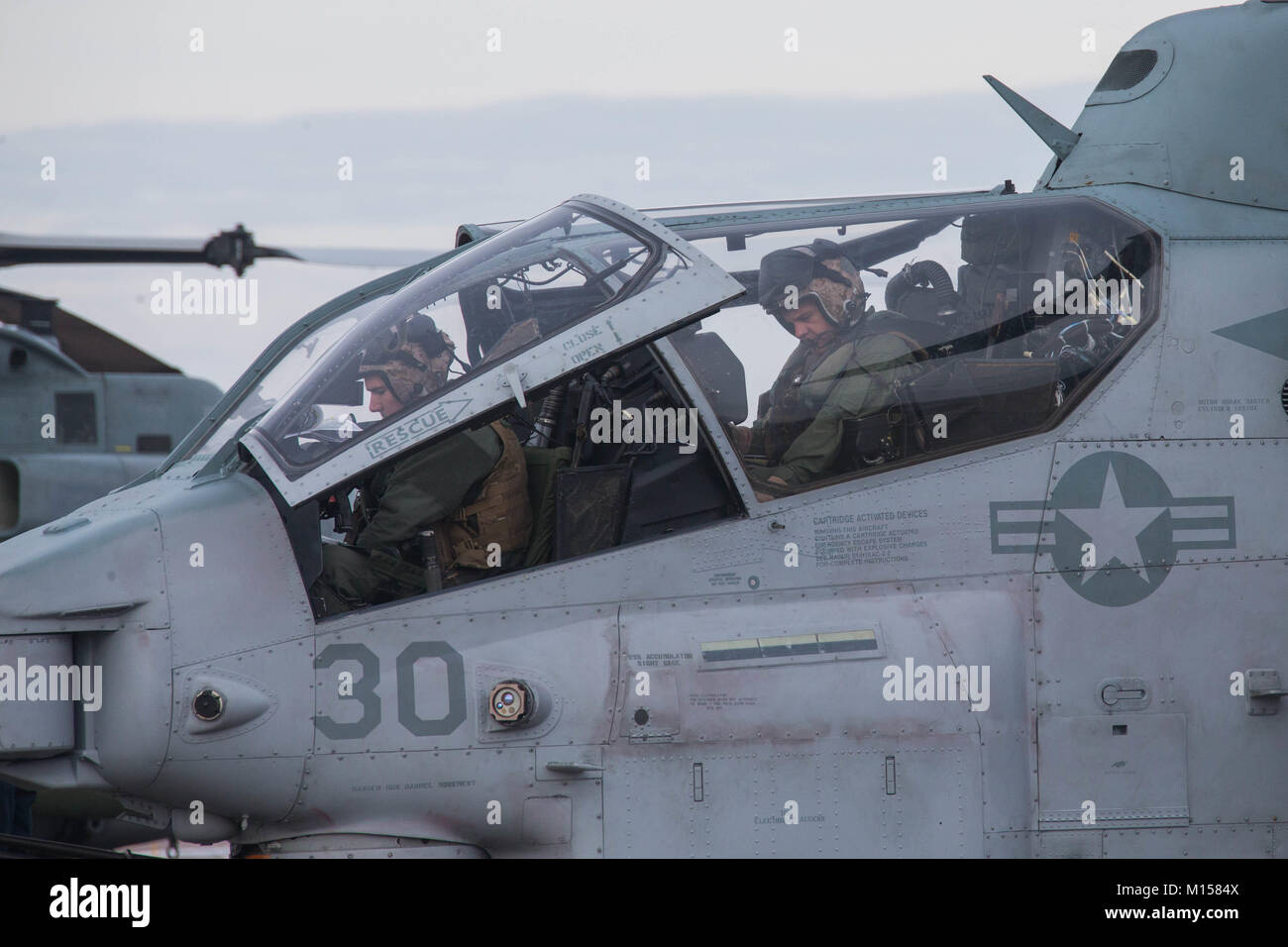 U.S. Marine Corps AH-1W Super Cobra pilots with Marine Light Attack ...