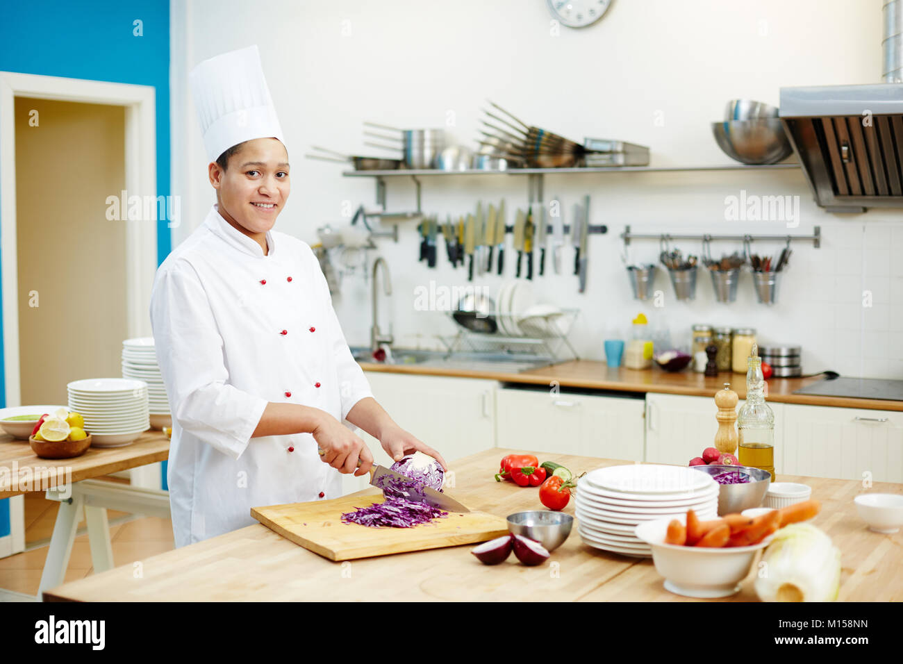 Chef cutting cabbage Stock Photo - Alamy