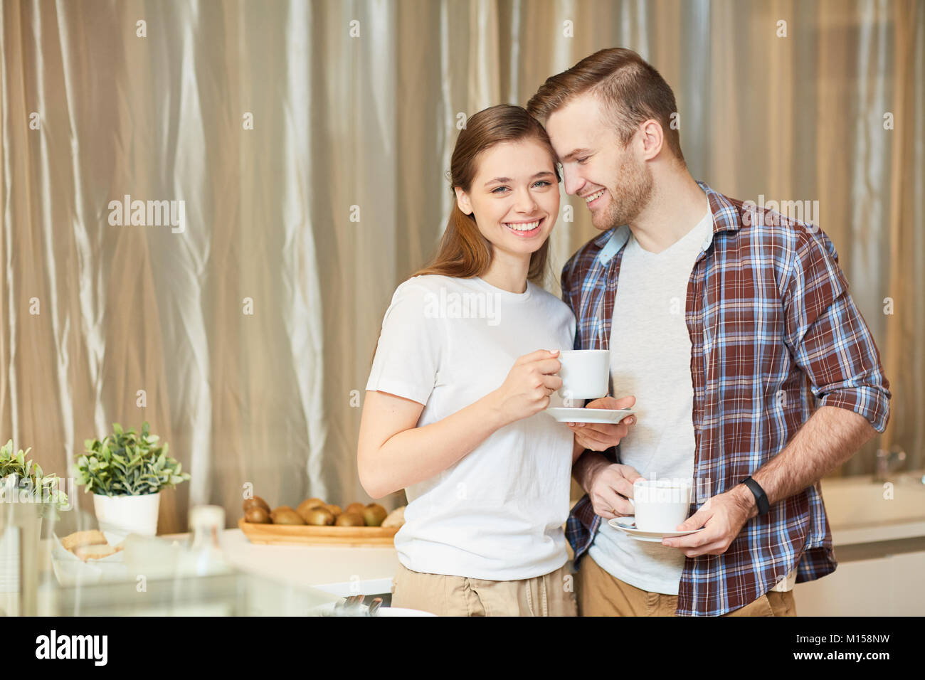 Couple having tea Stock Photo - Alamy