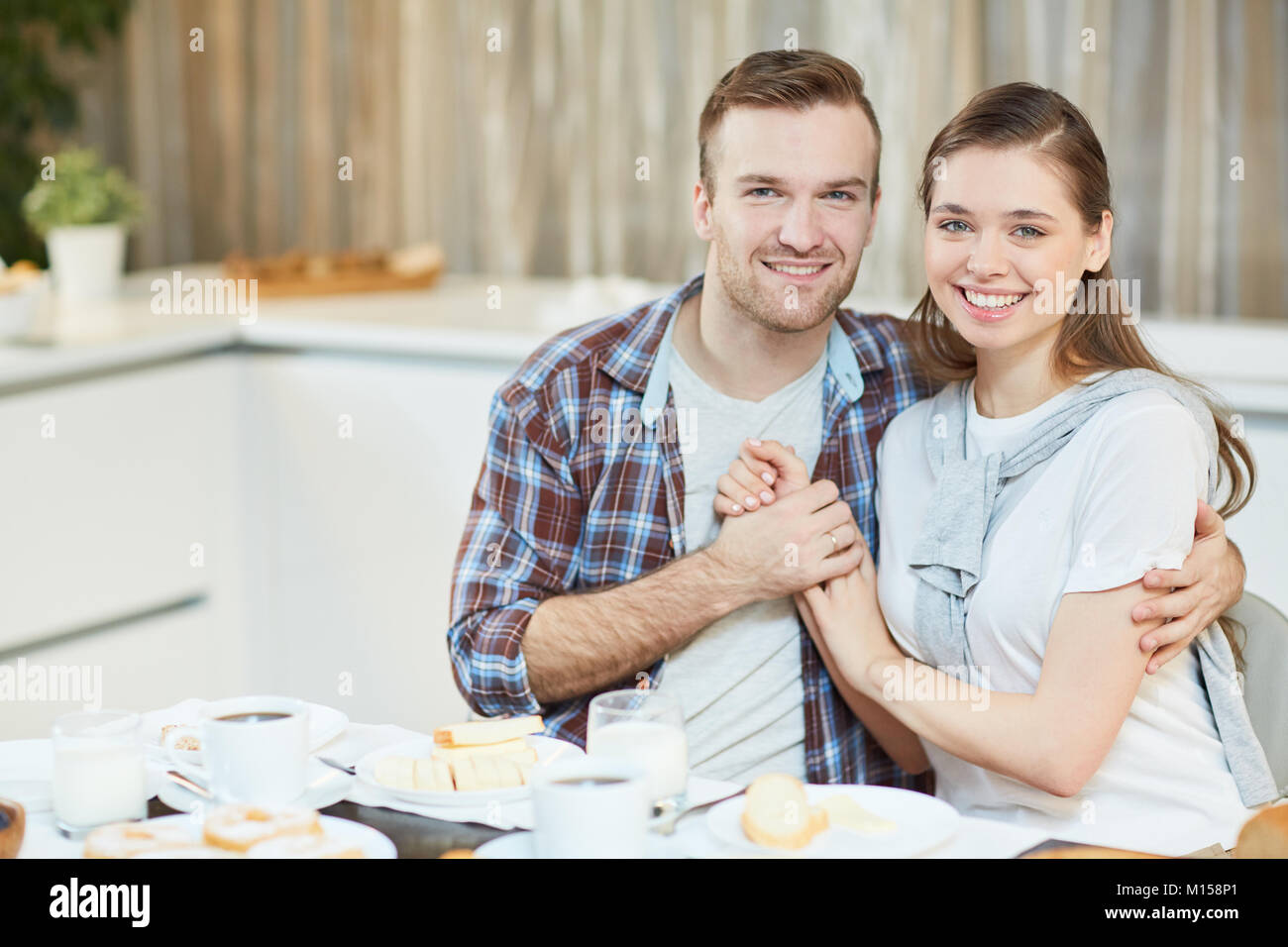 Couple by table Stock Photo - Alamy