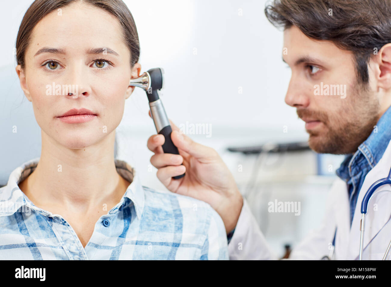 Young man hearing aid hi-res stock photography and images - Alamy