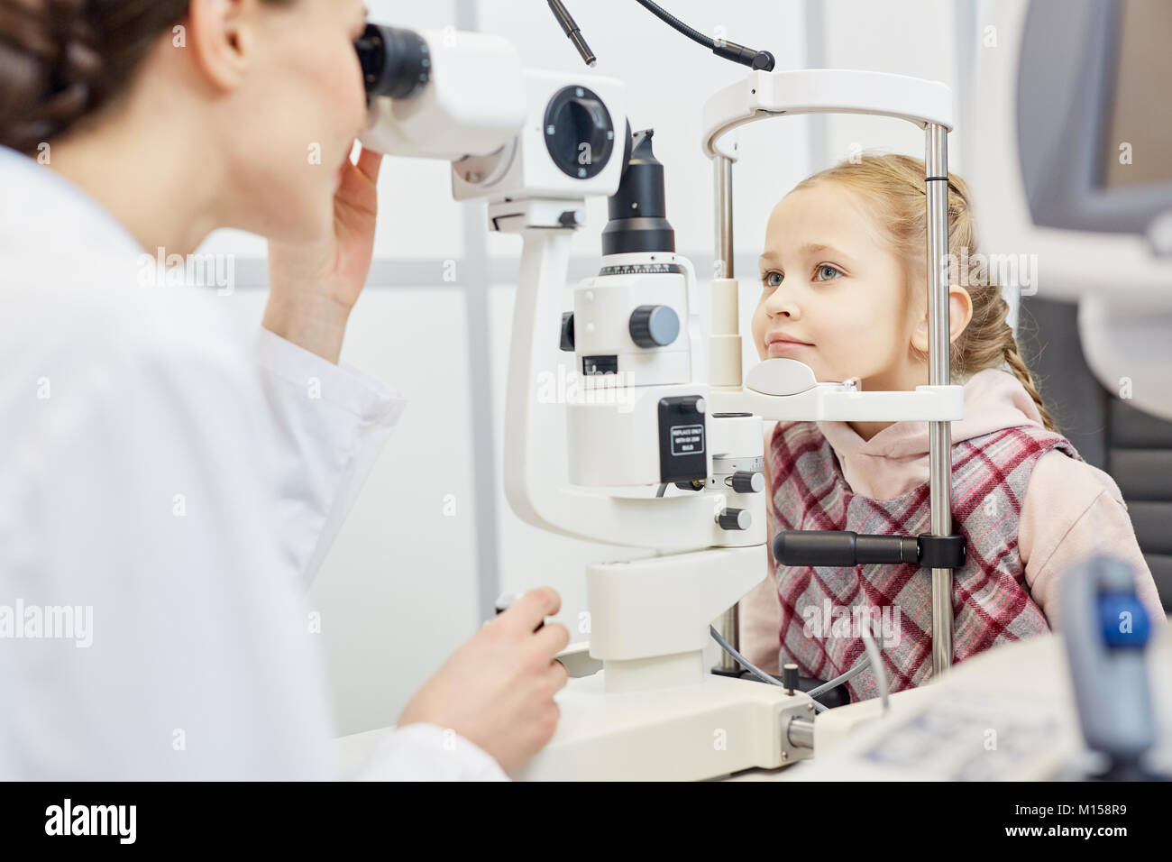 Checking retina hi-res stock photography and images - Alamy