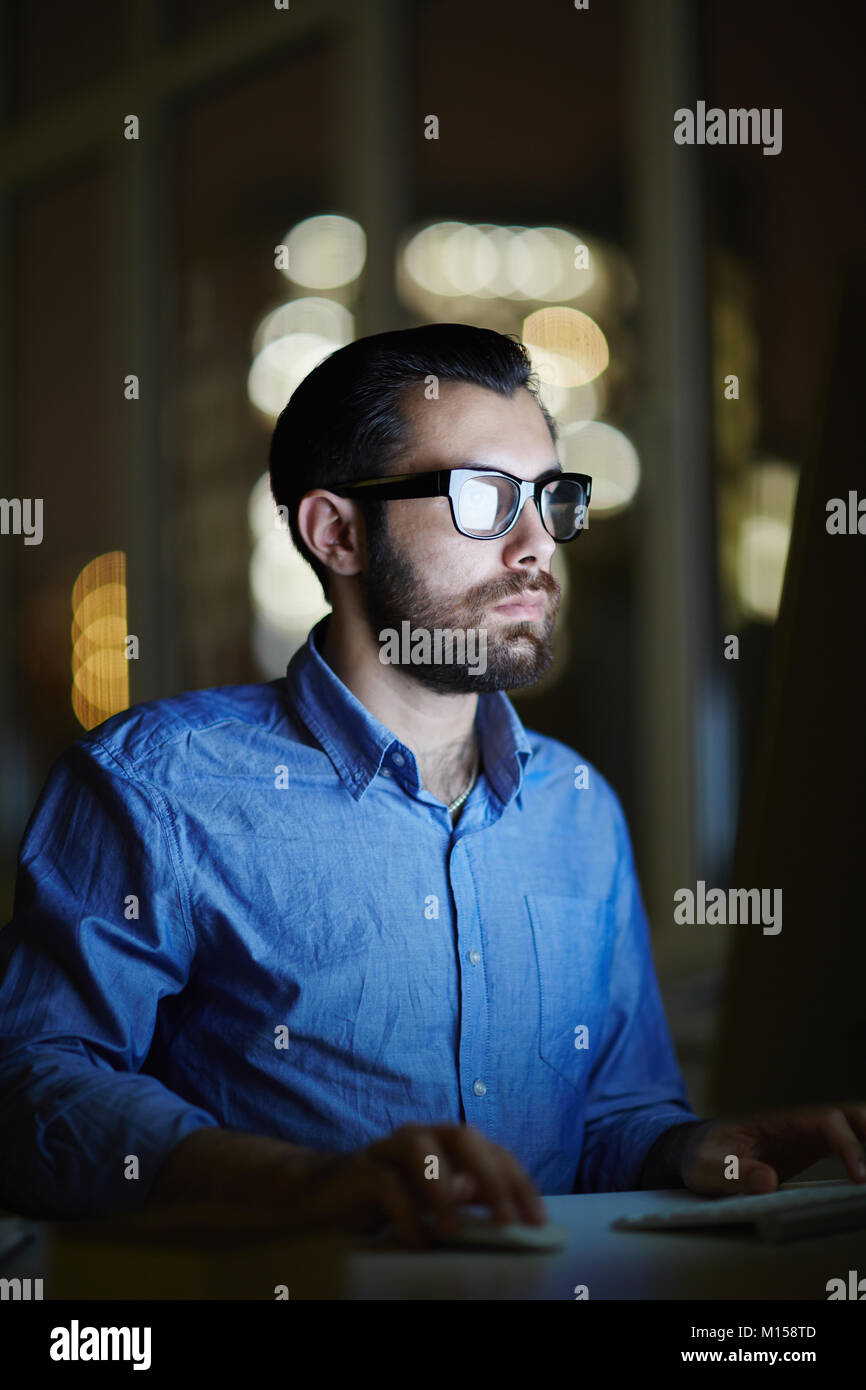 Man working late Stock Photo - Alamy
