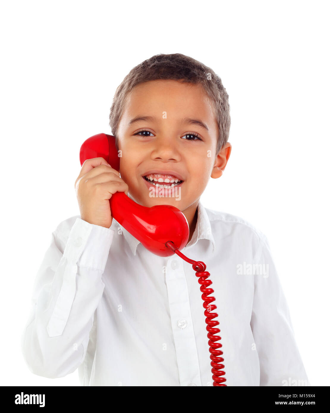 Funny small child talking on the phone isolated on a white background ...