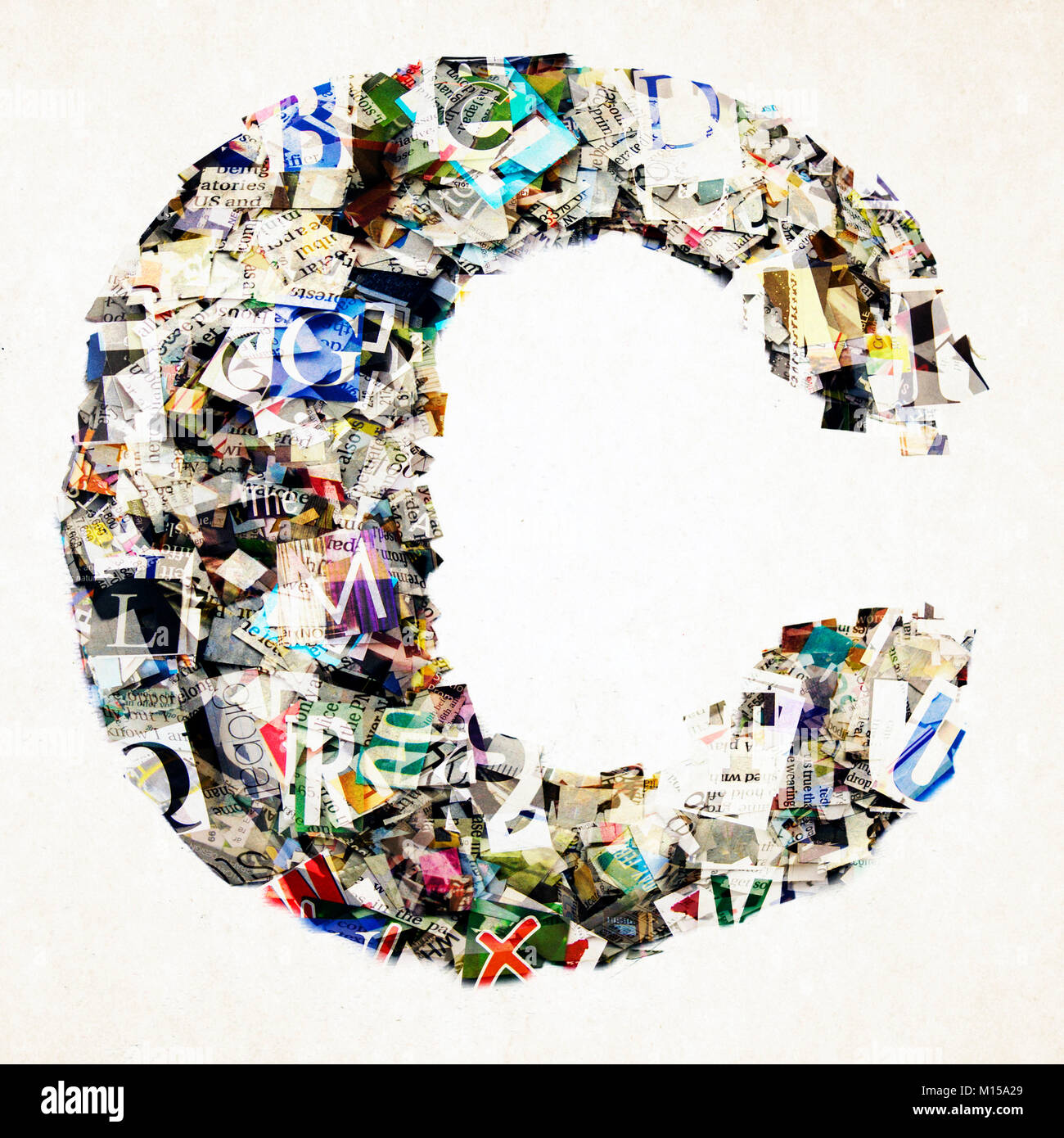 The letter C made from newspaper confetti Stock Photo - Alamy