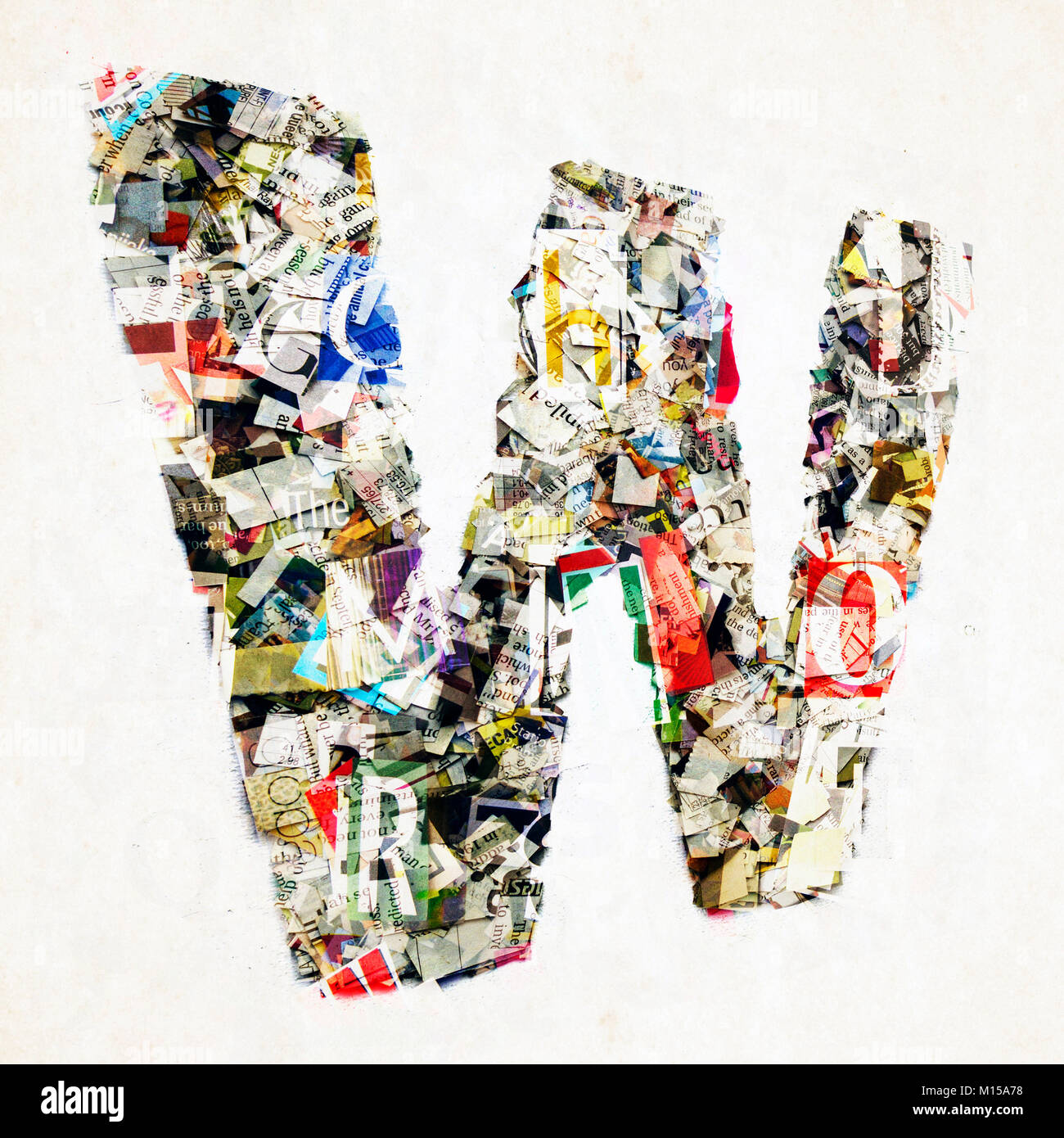 The letter W made from newspaper confetti Stock Photo - Alamy