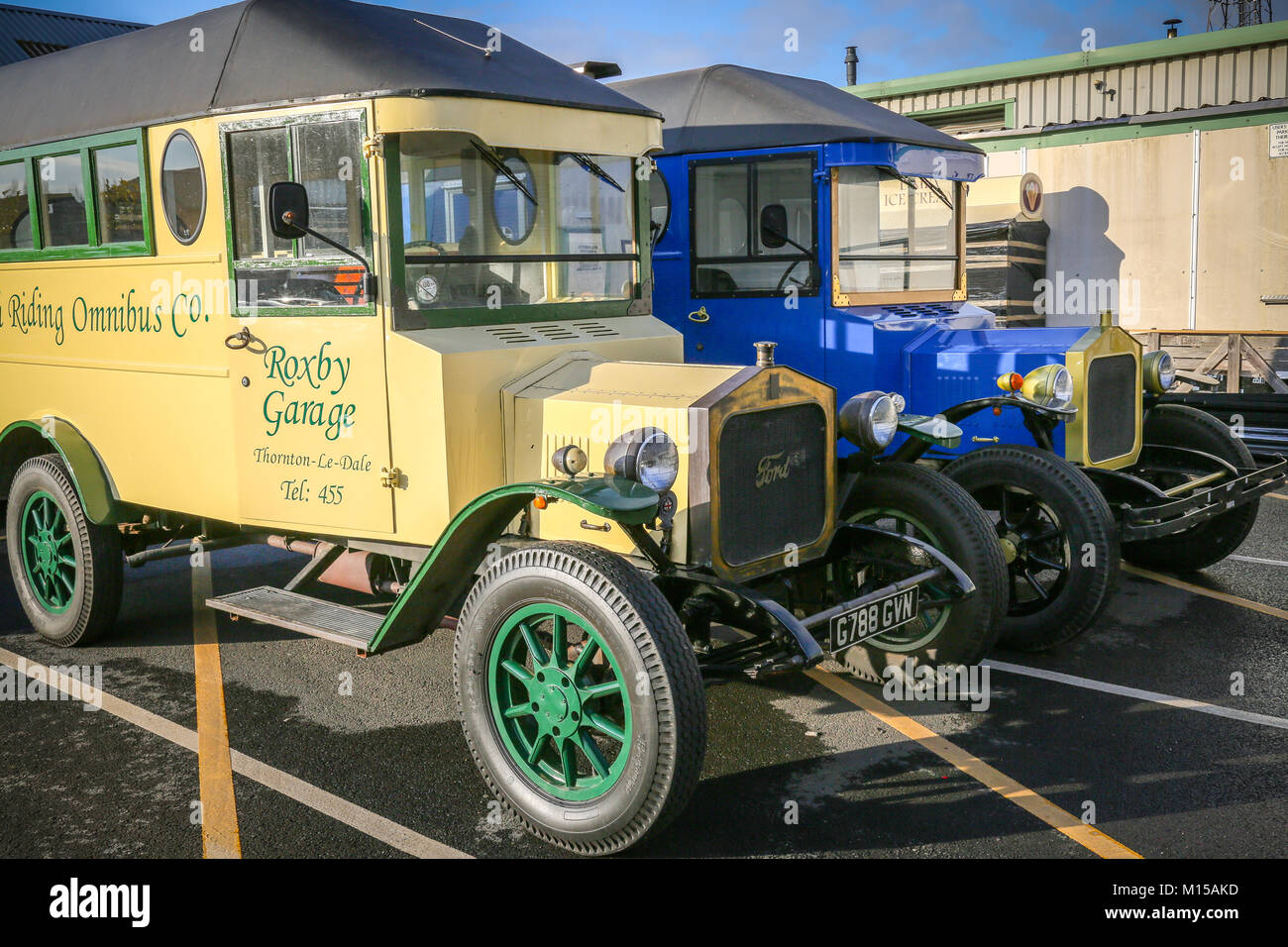 Vintage omnibus vehicles, one cream and one blue Stock Photo - Alamy
