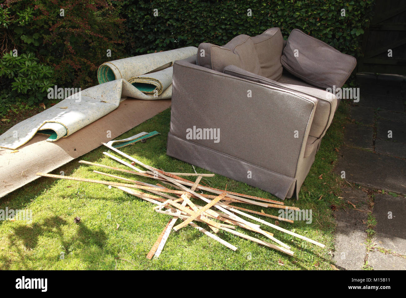 A sofa and a carpet being thrown out because of an infestation of moths ...