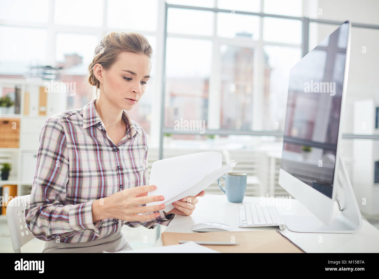 Secretary with papers Stock Photo - Alamy