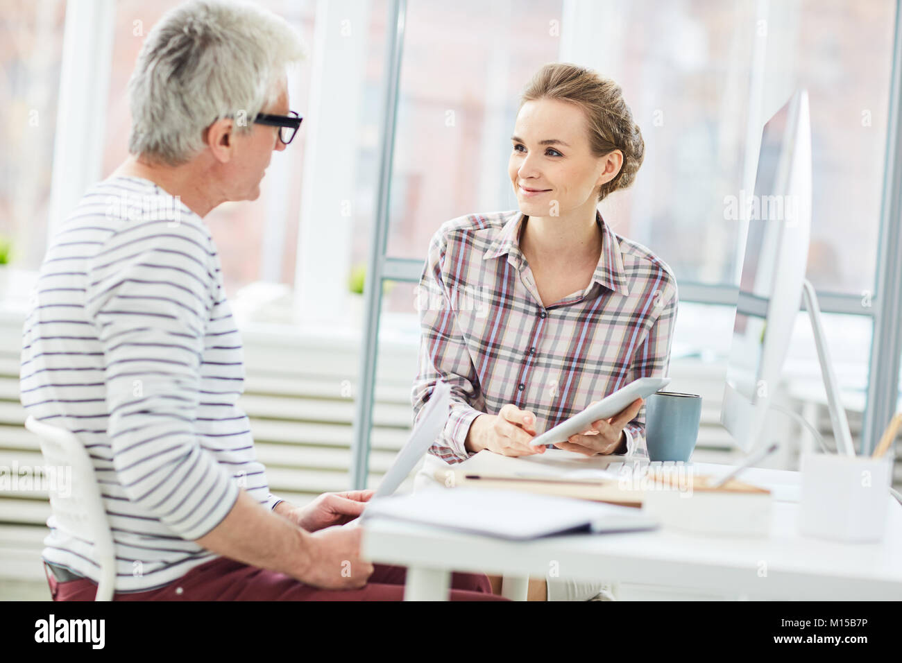 Talk with boss Stock Photo - Alamy