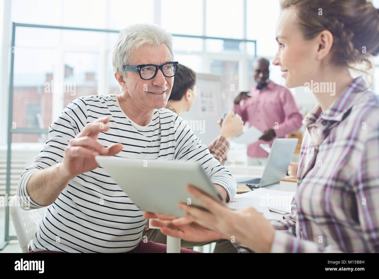 Talk with subordinate Stock Photo - Alamy