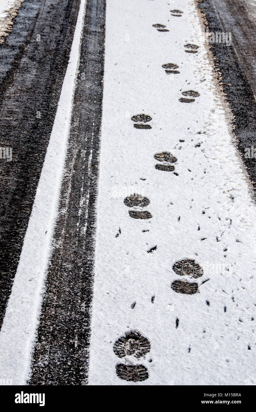 Footprints in snow Stock Photo - Alamy