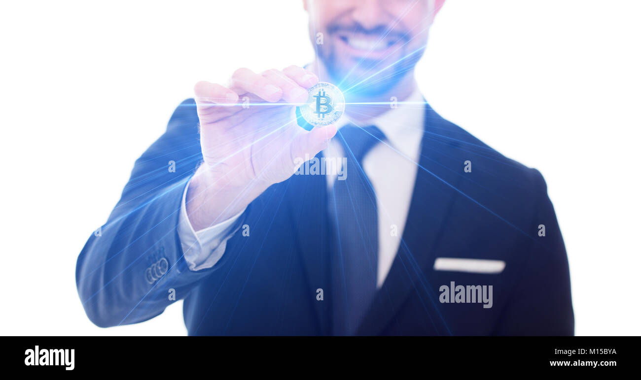 Happy businessman holding bitcoin coin with blue glowing shining ...