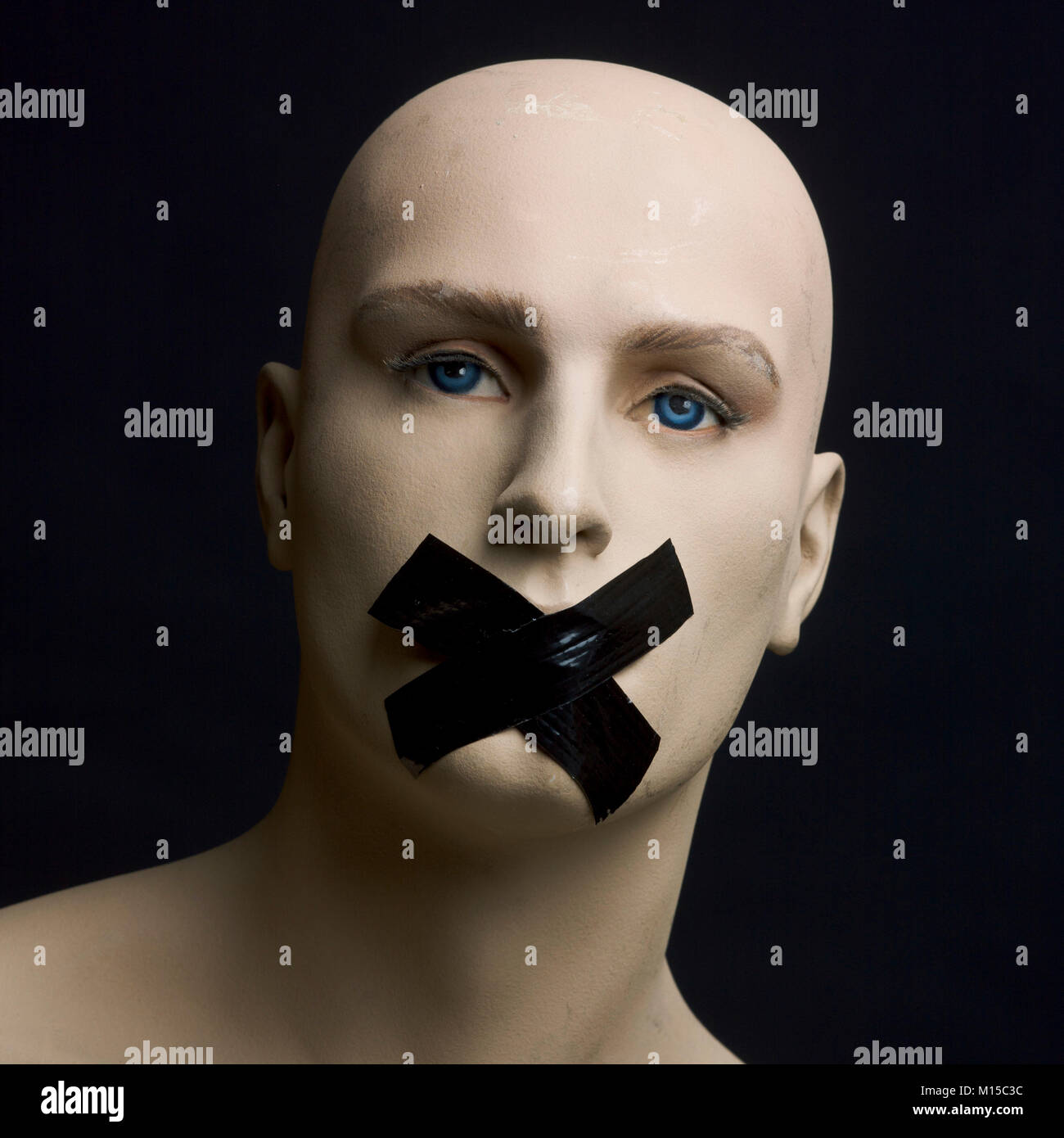 Mannequin with its mouth taped shut Stock Photo - Alamy