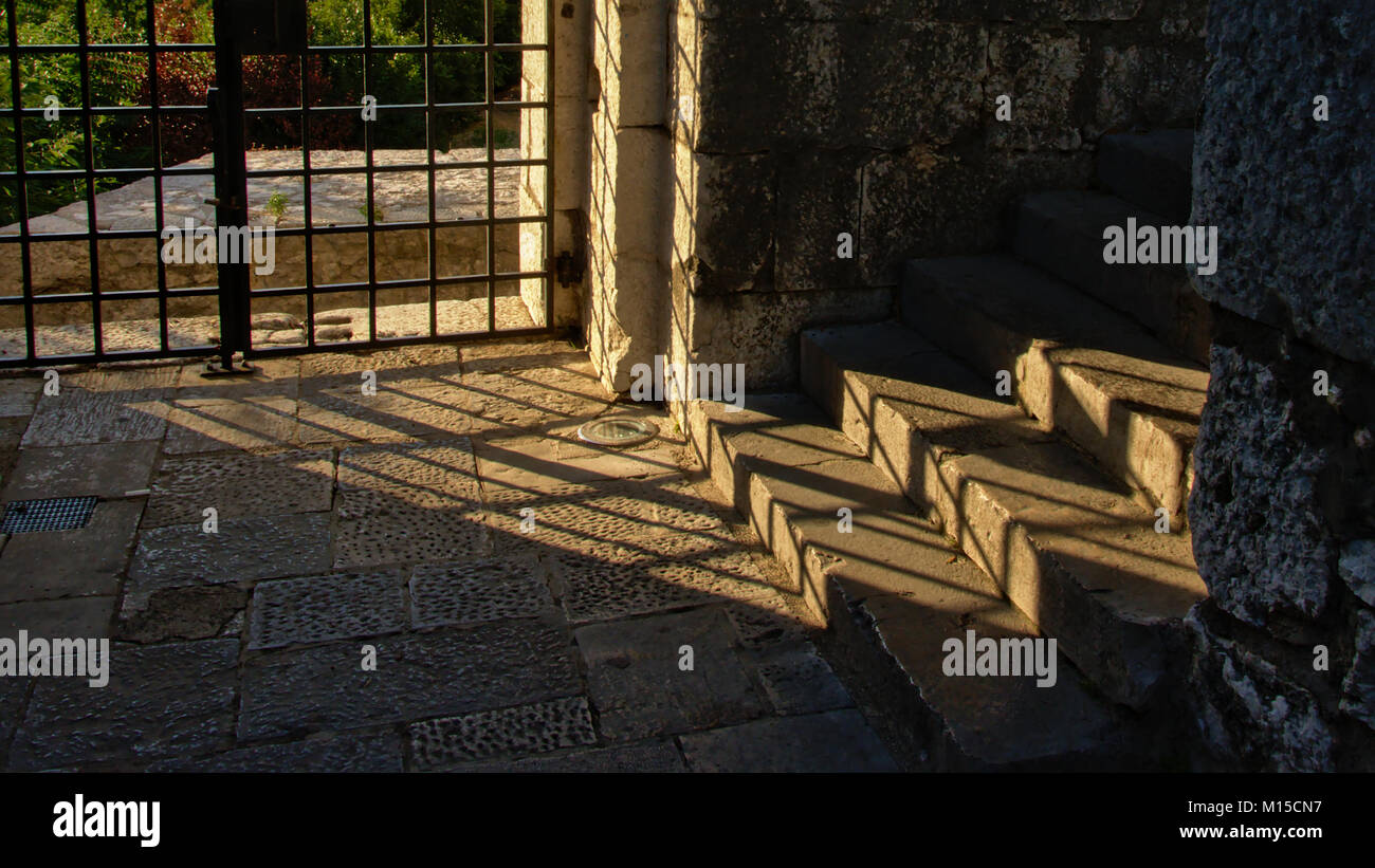 light and shadow play of metal bars on a staircase of Rijeka castle ...