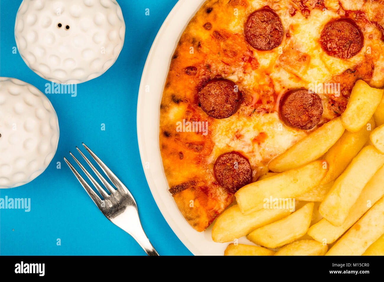 Italian Style Pepperoni Pizza With Chips Against A Blue Background ...