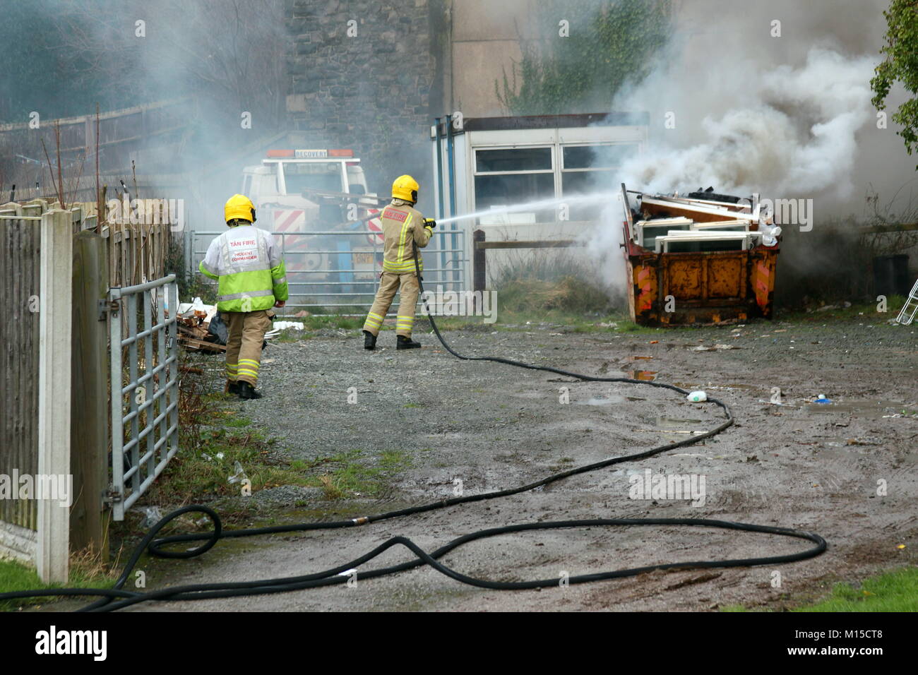 Fire Brigade attending a skip fire in North Wales Stock Photo - Alamy