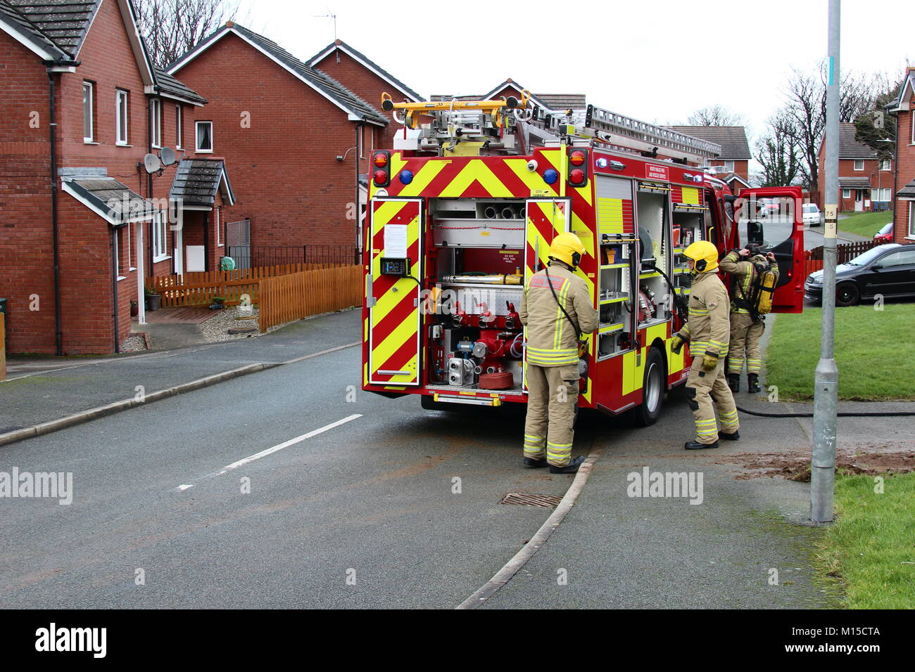 Fire Brigade attending a skip fire in North Wales Stock Photo - Alamy
