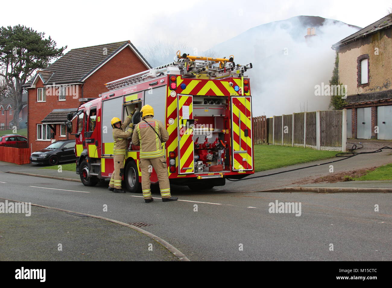 Fire Brigade attending a skip fire in North Wales Stock Photo - Alamy