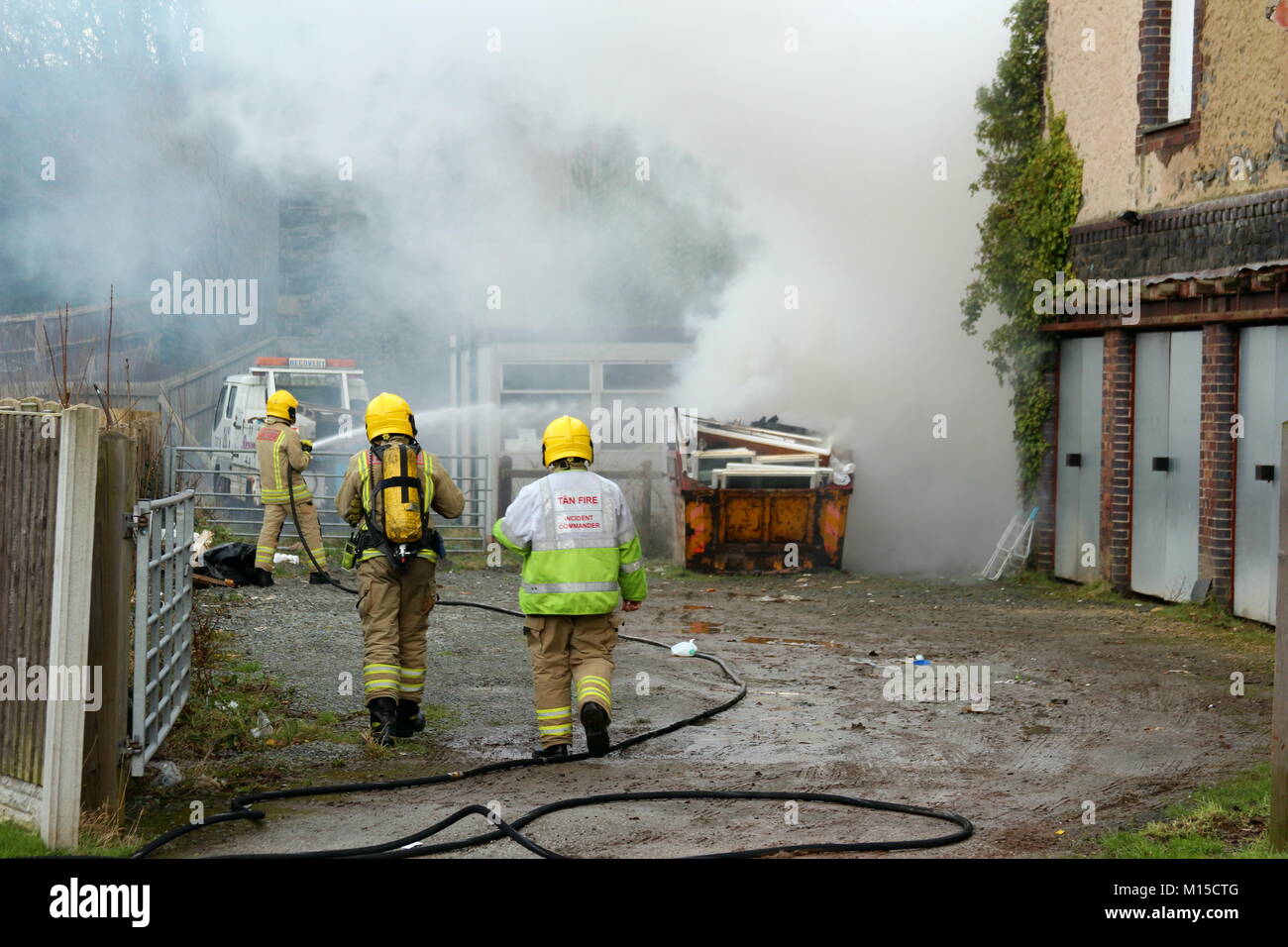 Fire Brigade attending a skip fire in North Wales Stock Photo - Alamy