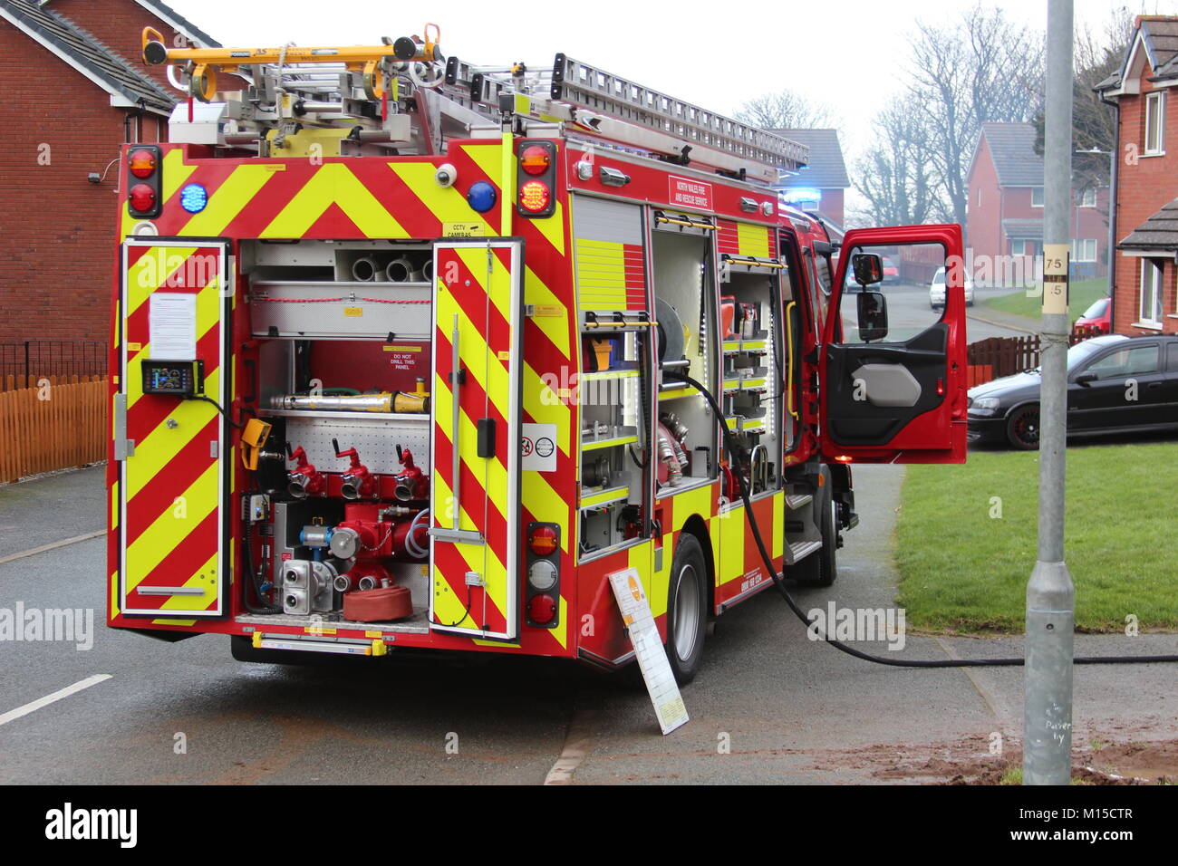 Fire Brigade attending a skip fire in North Wales Stock Photo - Alamy