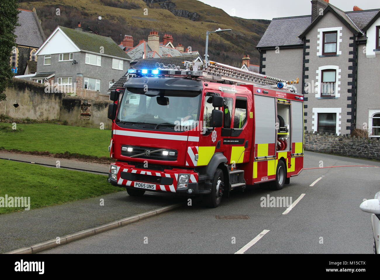 Fire Brigade attending a skip fire in North Wales Stock Photo - Alamy