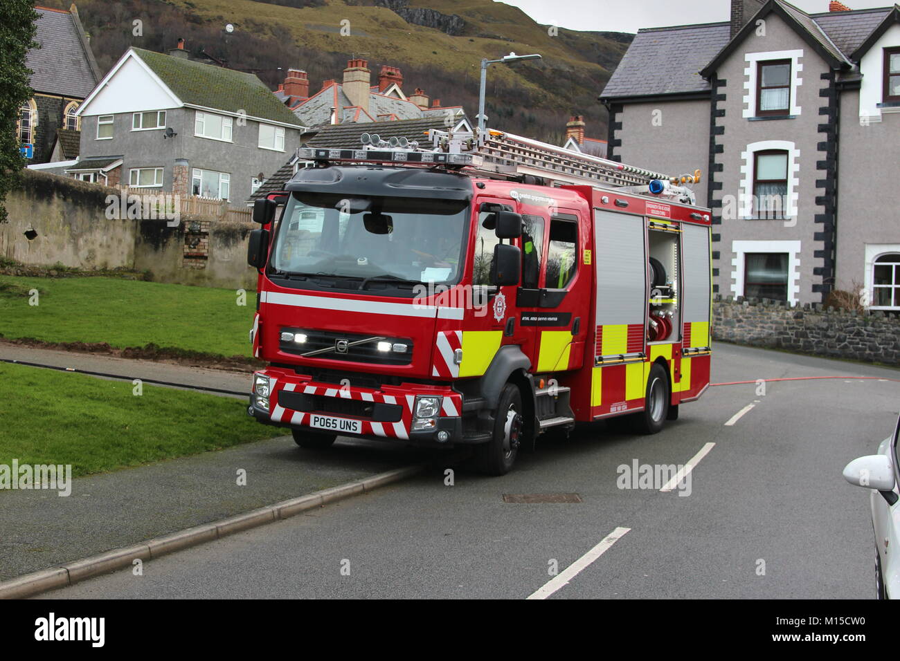 Fire Brigade attending a skip fire in North Wales Stock Photo - Alamy