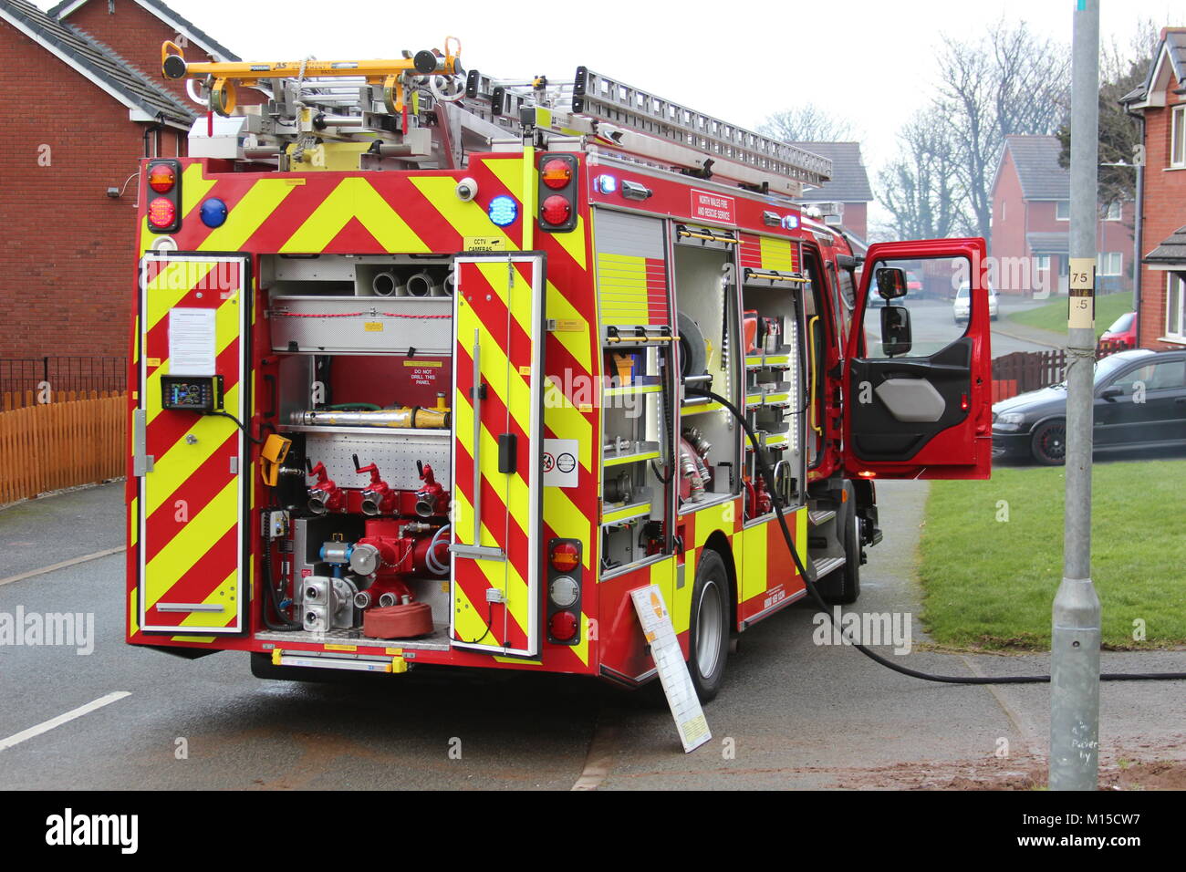 Fire Brigade attending a skip fire in North Wales Stock Photo - Alamy